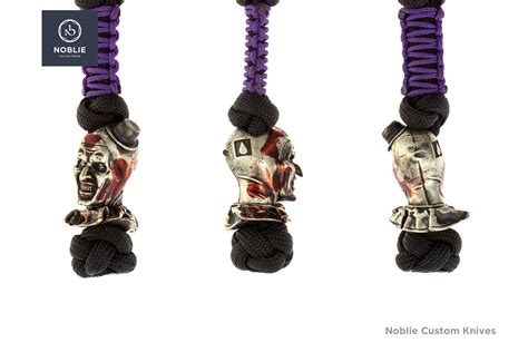 კლოუნის პარაკორდის მძივებიანი გასაღების ჯაჭვი გამორჩეული დანის ლენტის ხიბლი