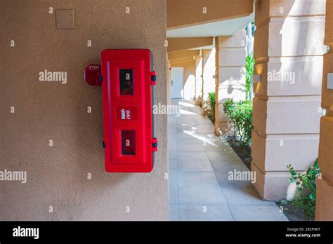 View Of Fire Extinguisher Box With Fire Extinguisher And Call Button On