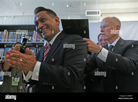 California Gov Jerry Brown Uses Assemblyman Gilbert Cedillos Back To Sign Assembly Bill 130