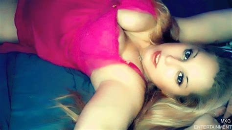 Busty Chick Maliah Showing Her Big Cleavage In Pink Outfit Photos