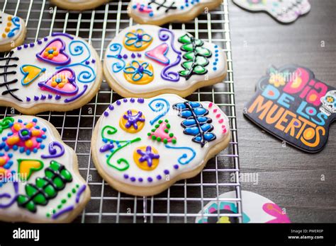 Sugar Cookies In Shape Of Sugar Skull Decorated With Colorful Royal