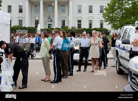 Female Environmental Activists And Protesters Arrested For Civil Disobedience In Front Of White