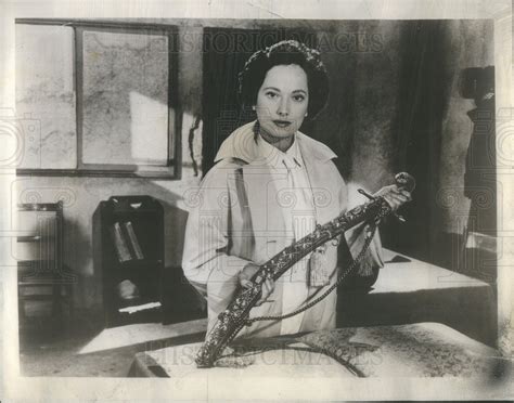 1957 Press Photo Assignment Foreign Legion Series Merle Oberon Holding