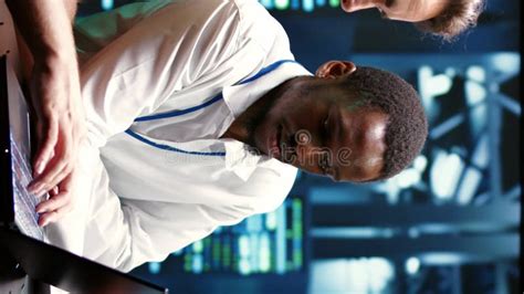 Vertical Video Coworkers Running Data Center Tests Stock Footage