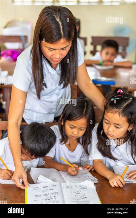 A Public Elementary School Teacher In Batangas Philippines Teaches Her