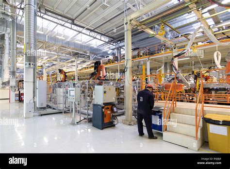 Workers Assemble A Vehicle Body Process Of Welding Cars Modern