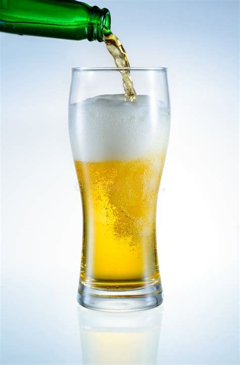 Beer Is Pouring From Bottle Into The Glass Stock Image Image Of Glass Golden 36620885