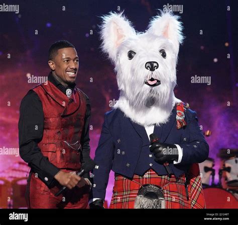 The Masked Singer From Left Host Nick Cannon Mcterrier Masks Back