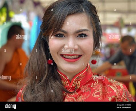 Young Thai Woman With Red Dental Braces Red Lipstick And Chinese Silk