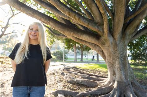 Woman With Braces Standing Beside Large Tree Stock Image Image Of