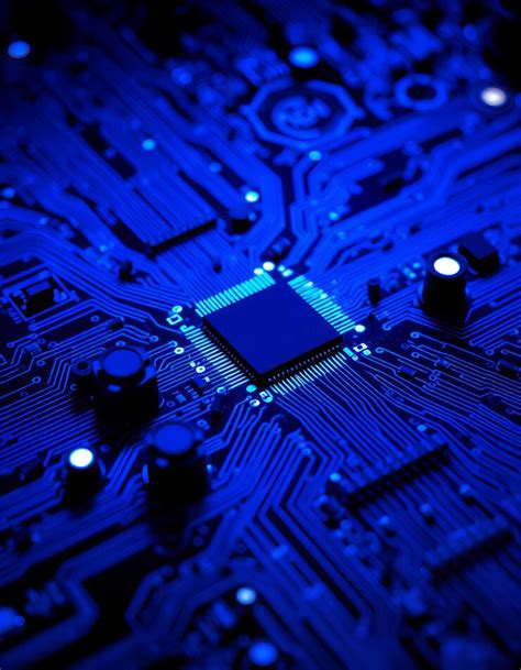 Blue Circuit Board With Microchips And Connections Glowing In The Dark Highlighting Advanced
