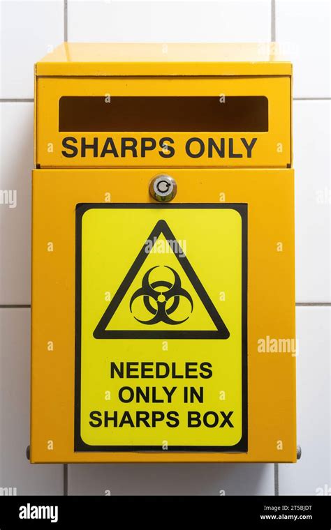 Sharps Bin For Disposing Safely Of Needles Stock Photo Alamy