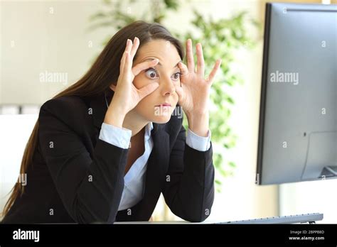 Sleepy Businesswoman Trying To Stay Awake Keeping The Eyes Opened With The Fingers Watching A