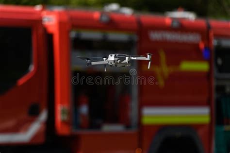 small drone used for search and rescue next to a fire engine stock