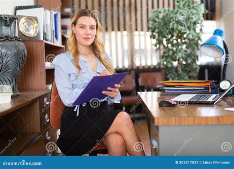 Woman Secretary Standing In Modern Office With Clipboard Stock Image