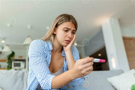 Shocked Woman Looking At Control Line On Pregnancy Test Single Sad