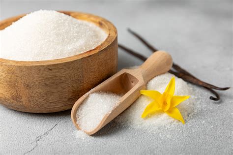 아로마 바닐라 설탕 바닐라 꼬투리 바닐라 스틱 질감 배경에 그릇에 갈색과 흰색 설탕 디저트와 베이킹을 위한 바닐라 꽃 향신료 및 허브 텍스트를 위한 공간입니다 공간 복사 0