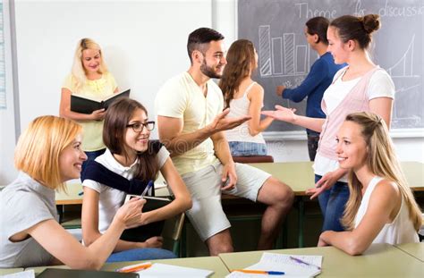 Group Of Students Chatting In Classroom Stock Image Image Of Informal Caucasian 57568185