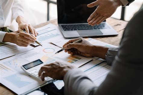 Premium Photo Businessmen Team Or Financial Data Analysts Working With Tablets And Laptop