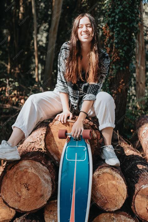 Premium Photo Young Woman Sitting Over Pile Of Trunks Resting During