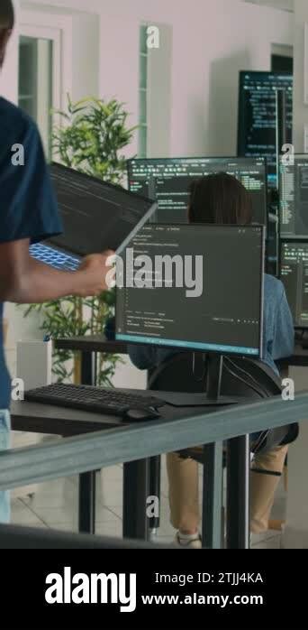 Vertical Video African American Developer Using Laptop To Write Code
