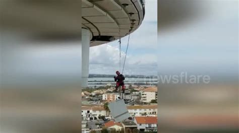 Firefighters Remove Lighthouse Cladding Endangering Public Road In