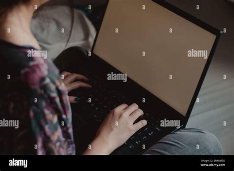 Woman Taking Notes On A Laptop Stock Photo Alamy