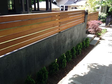 Colorbond Fence On Top Of Concrete Sleeper Retaining Wall