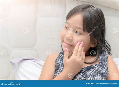 Cute Girl Applying Body Lotion Cream On Her Cheek Stock Image Image
