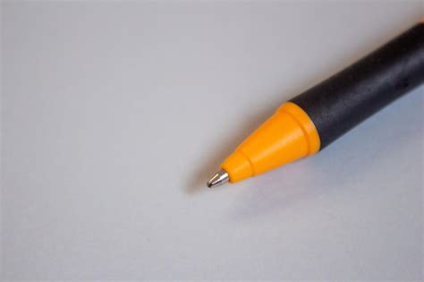 Premium Photo A Pen With A Small Tip That Says The Pen Is On A Gray