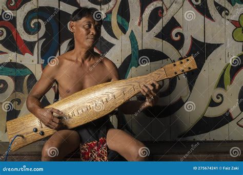 Traditional Dancer At Sarawak Village Demonstrate His Traditonal