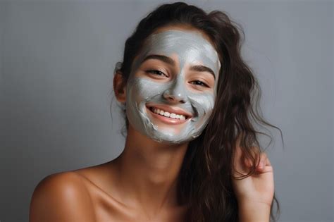 Premium Photo Smiling Pretty Woman With Facial Mask On Her Face