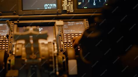 Premium Photo Male Copilot Inserting Flight Coordinates To Arrive At Destination Using