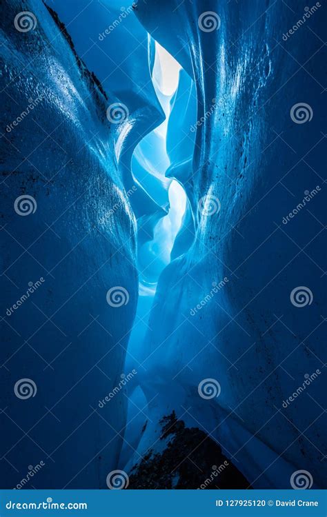 Icy Depths Of The Matanuska Glacier Inside A Water Filled Crevasse Full Of Small Icebergs Stock