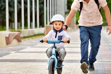 First Lessons Bicycle Riding Father Teach His Son To Ride A Bike Stock