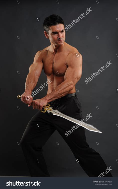 Sexy Man Holding New Age Sword Stock Photo Shutterstock