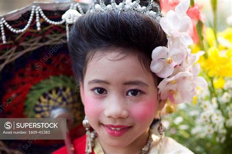Thailand Chiang Mai Portrait Of Girl In Traditional Thai Costume At The Chiang Mai Flower