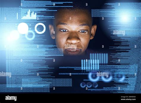 Hes Got All The Data In Front Of Him A Young Computer Programmer Working On Source Code Stock