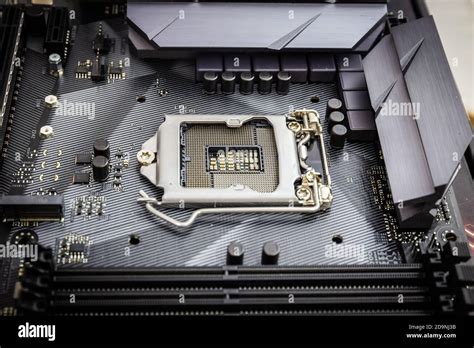 Closeup Detail Of CPU Socket Of A Modern Computer Black Motherboard Electronic Small Component