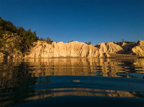A Beautiful Lake And A Small Beach Illuminated By The Morning Sun Landscape Stock Image Image