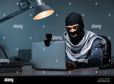 Hacker Wearing Balaclava Mask Hacking Computer Stock Photo Alamy
