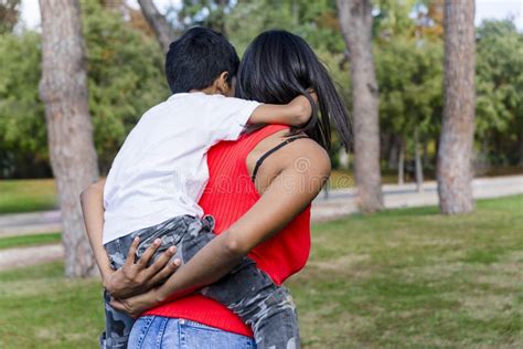 Happy Mother And Son Enjoying Together Outdoors In A Park Stock Image Image Of Grass Holding