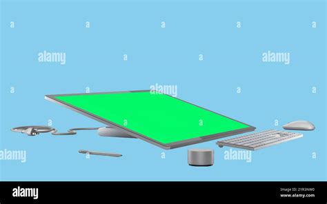 A Digital Workspace Featuring A Green Screen Monitor Keyboard Mouse Stylus And Speaker For