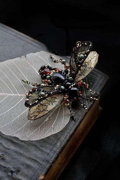 Купить или заказать Брошь Жук в ручной вышивке в интернет магазине на Ярмарке Мастеров