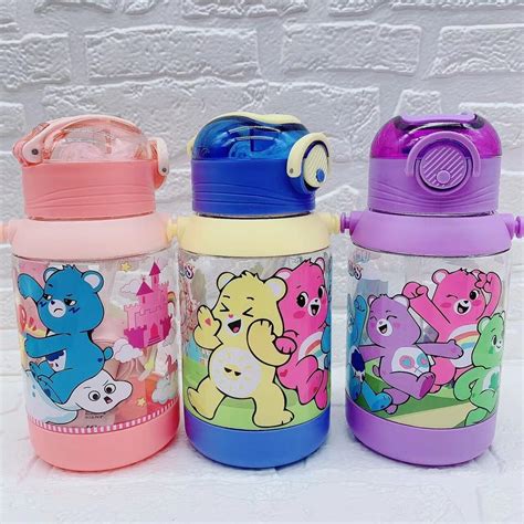 กระติกน้ำหลอดเด้ง ลายการ์ตูน ความจุ 600 Ml พร้อมสายสะพาย หลอดเด้ง มีตัวล็อคกันหก Pluemtshop