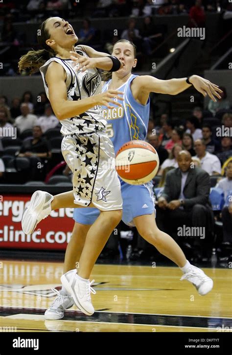 Silver Stars Becky Hammon 25 Gets Fouled By Chicago Skys Erin Thorn 05 In The First Half