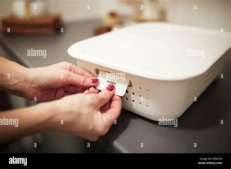 Woman S Hands Putting Label On Basket Stock Photo Alamy