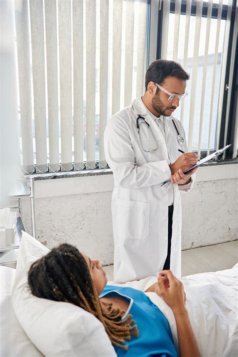 Good Looking Indian Doctor Taking Notes Stock Image Image Of Disease