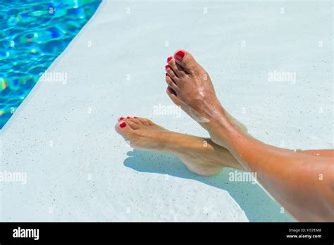 Woman S Feet At The Swimming Pool Stock Photo Alamy