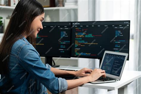 Premium Photo Smiling Asian It Typing Online Software Development On Laptop Stratagem